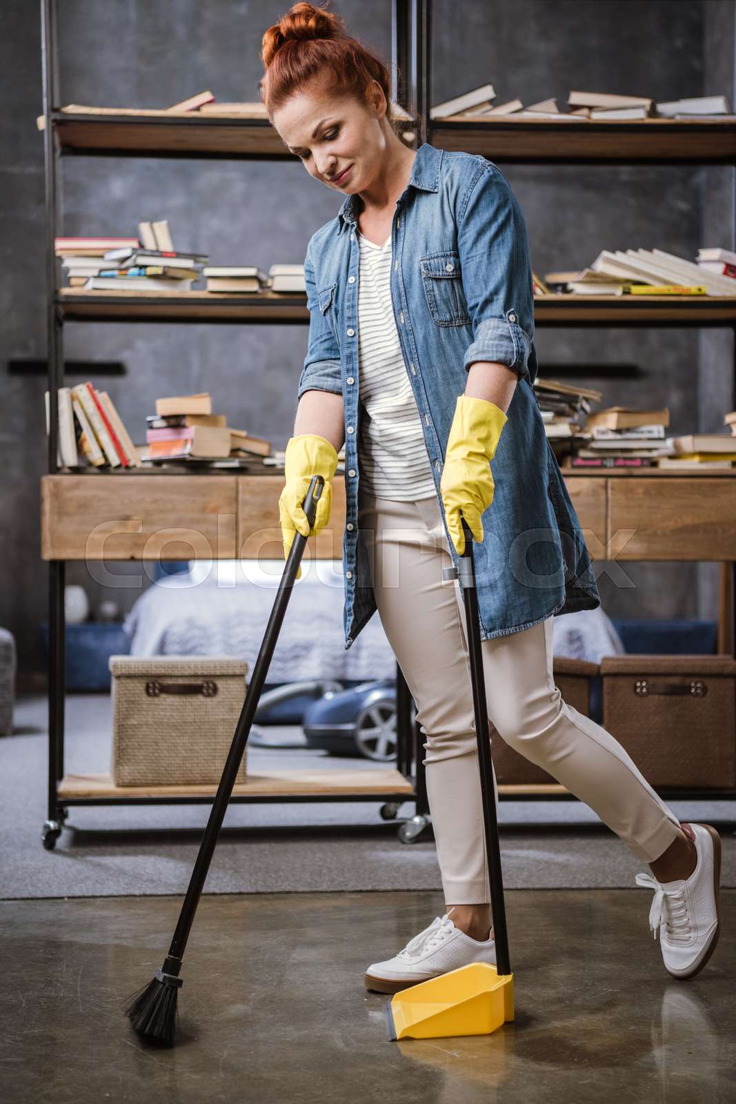 Woman sweeping floor | Stock image | Colourbox