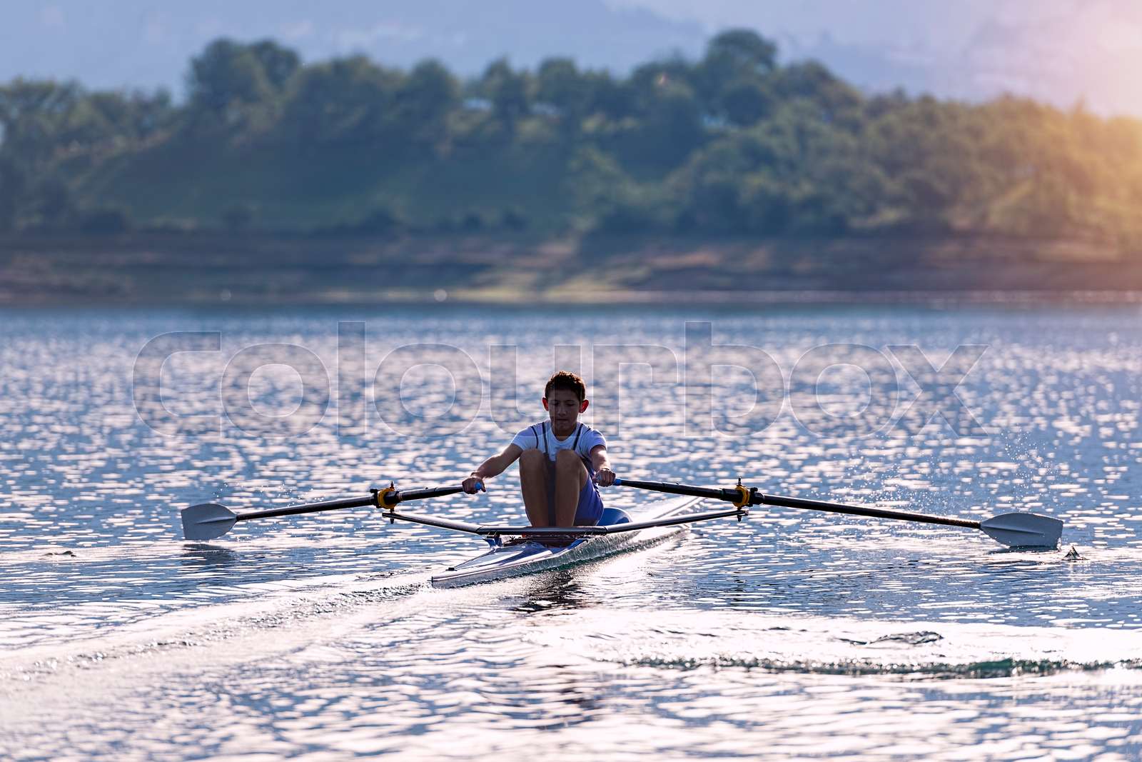 Child in the course of rowing on single | Stock image | Colourbox