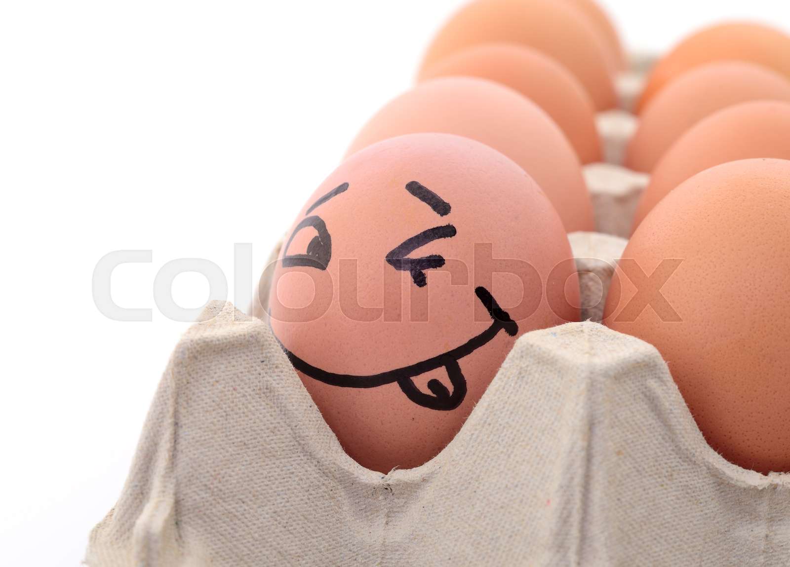 Smiling egg in a carton box. | Stock image | Colourbox