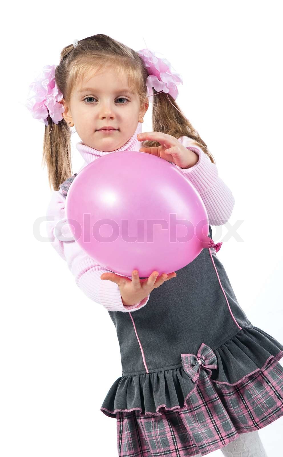 Pretty little girl with balloon over white | Stock image | Colourbox