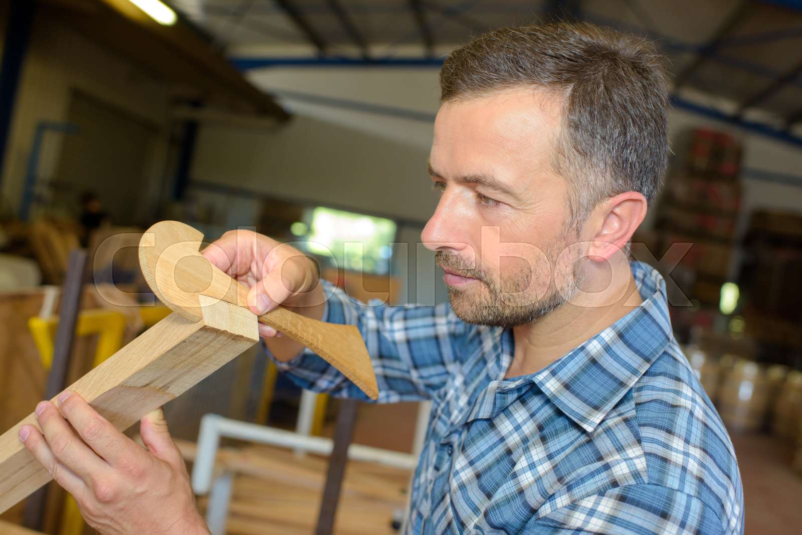 sawmill employee working with wood tools and machinery | Stock image ...