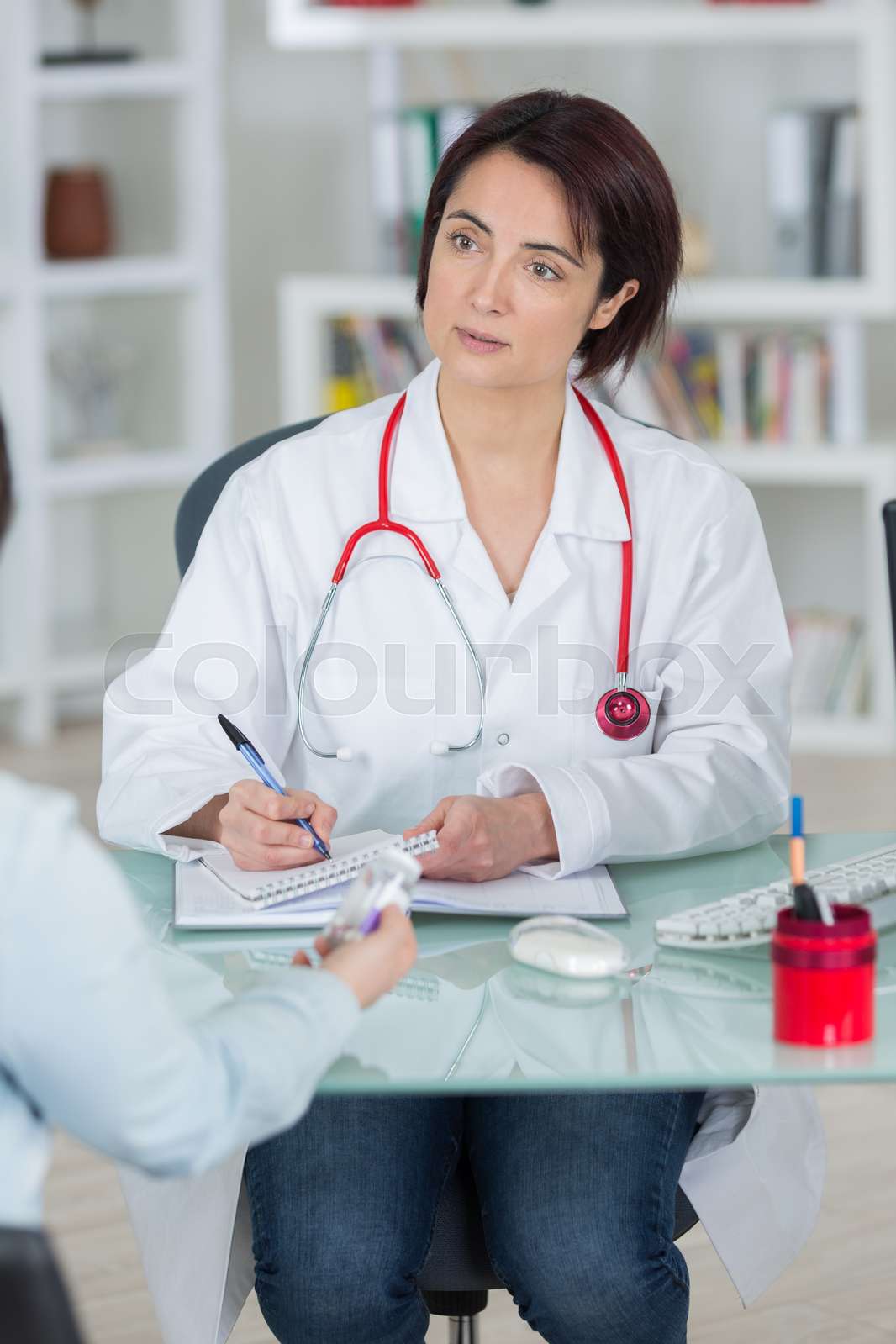 doctor giving the prescription | Stock image | Colourbox