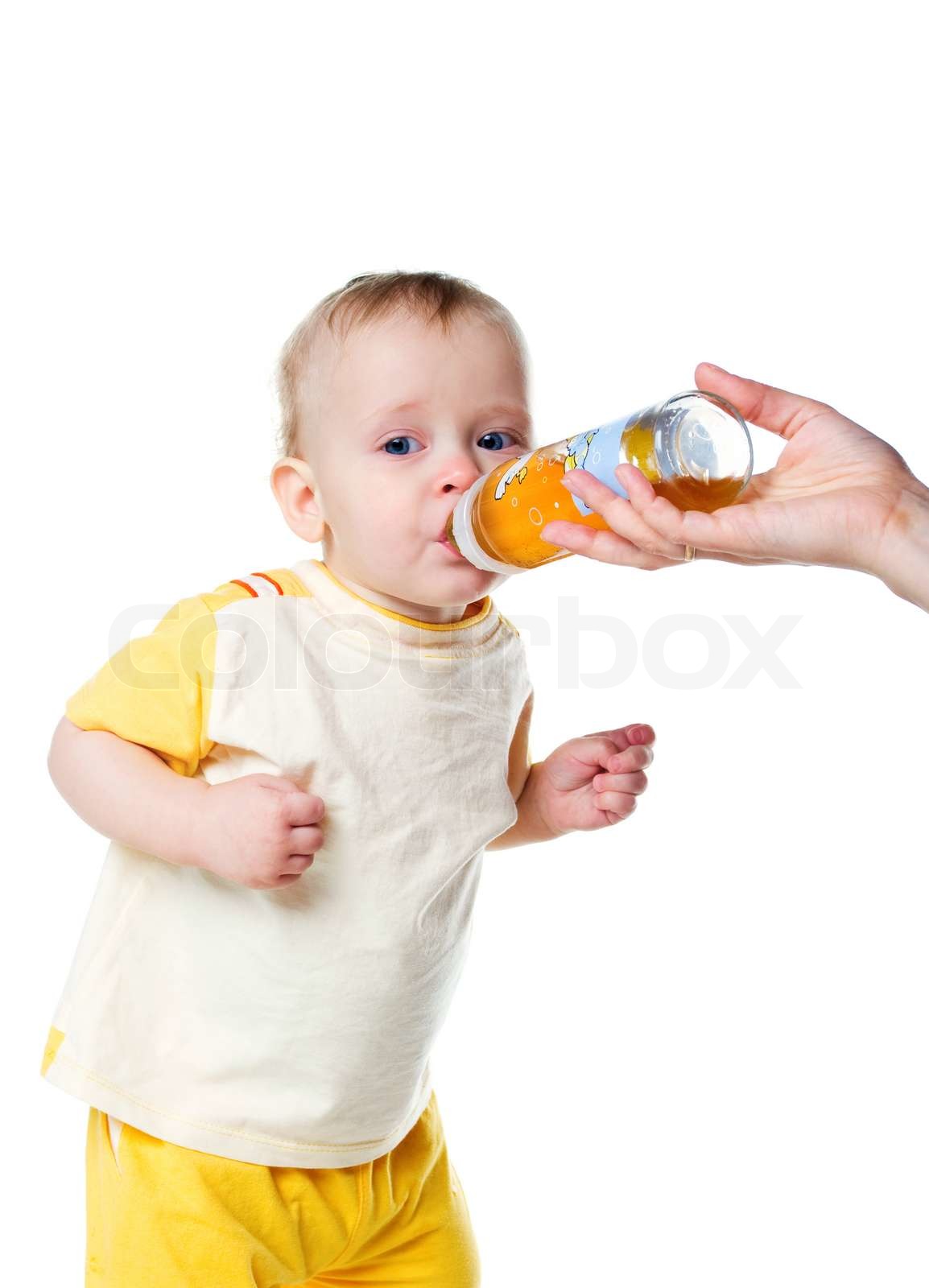 Cry baby drink fruit juice. Studio shot | Stock image | Colourbox