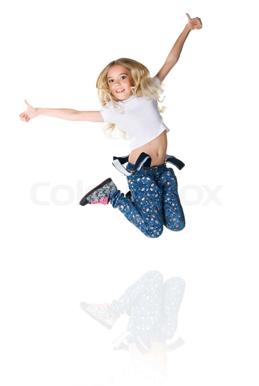 Cute little girl jump. Studio shot. White background | Stock image ...