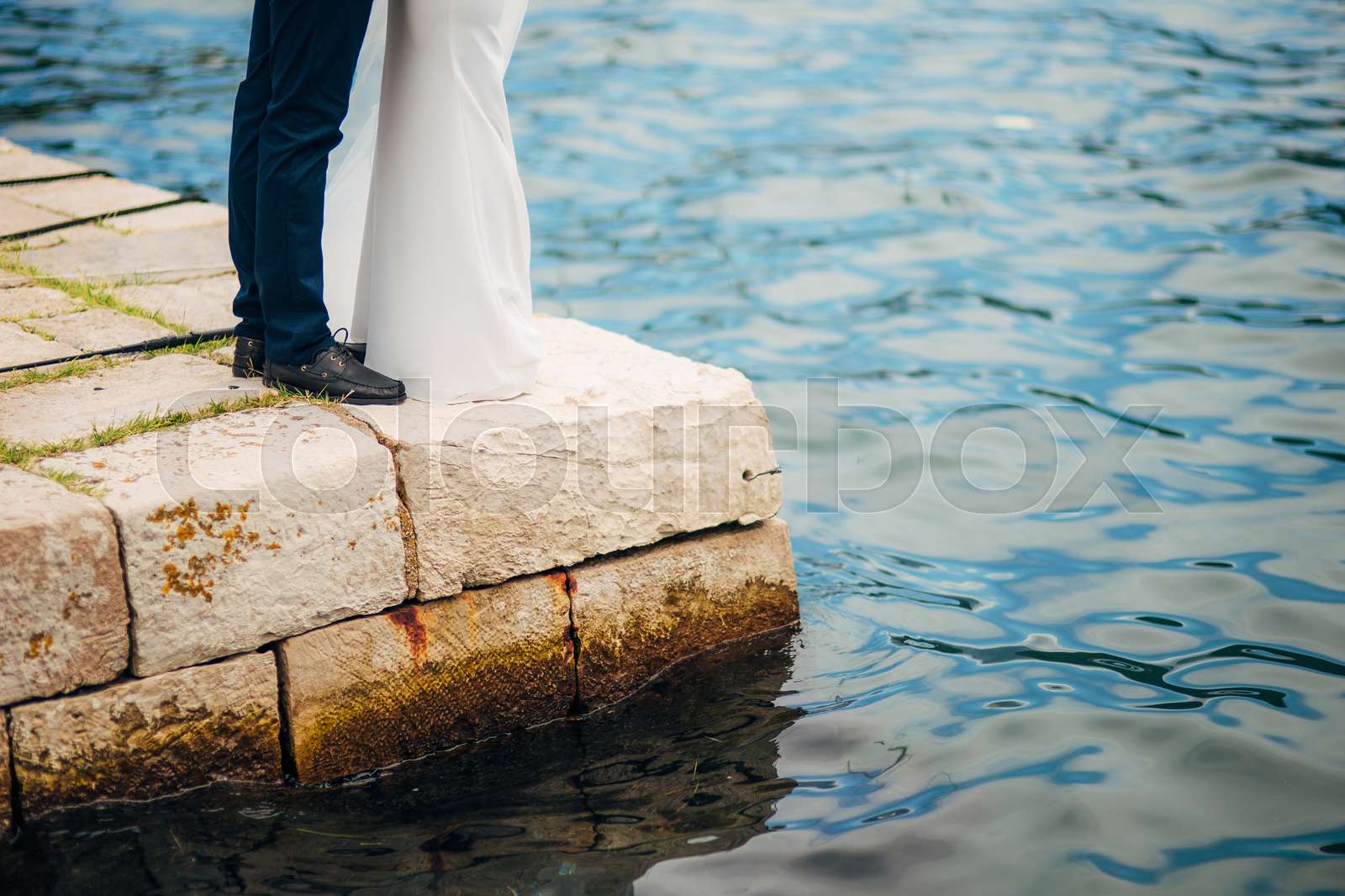 Female and male feet on the dock | Stock image | Colourbox