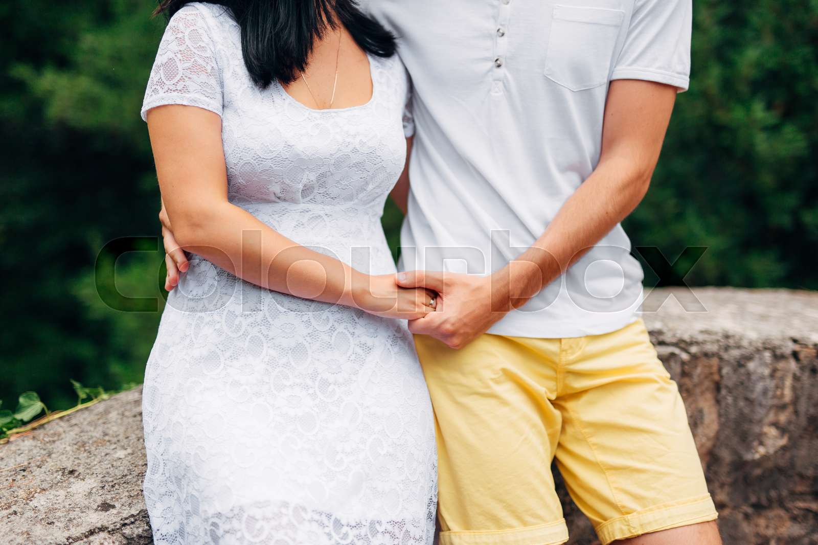 Bride and groom holding hands | Stock image | Colourbox