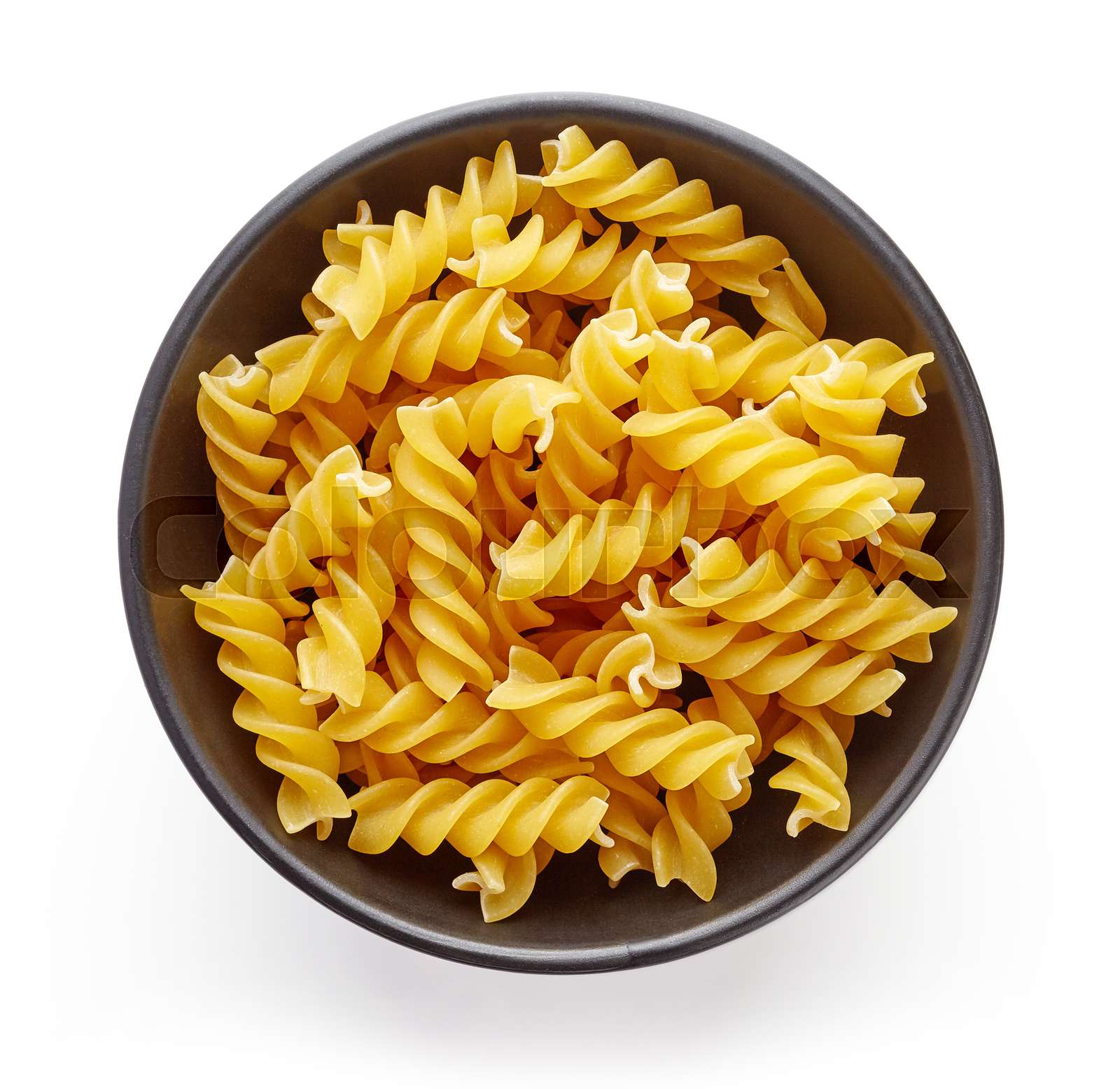 pasta in bowl isolated on white, from above | Stock image | Colourbox