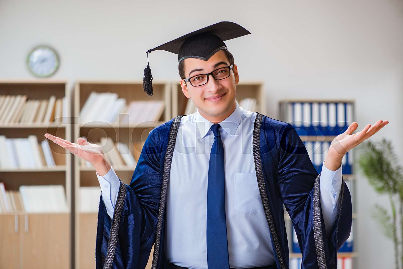 Young man graduating from university | Stock image | Colourbox