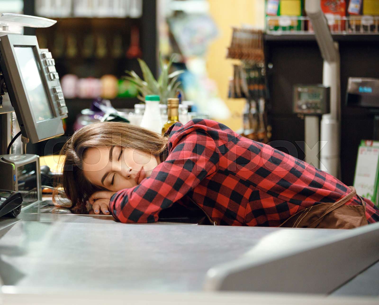 Cashier lady sleeping on workspace in supermarket shop. | Stock image ...