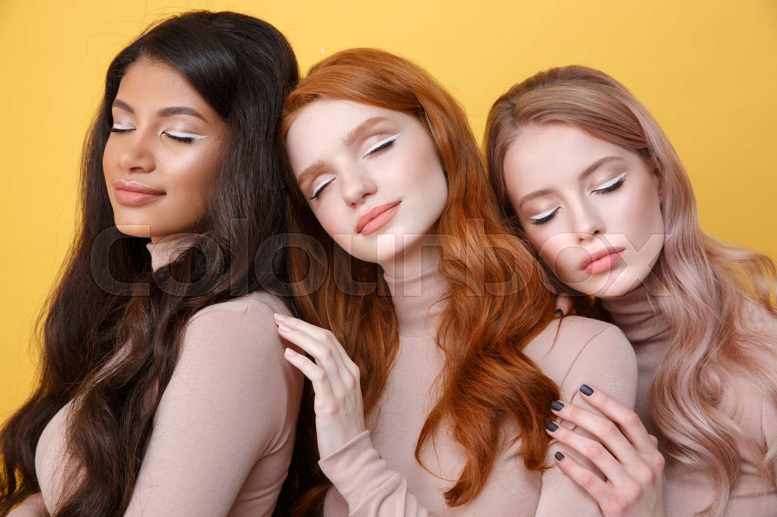 Close up picture of Three ladies posing in studio | Stock image | Colourbox