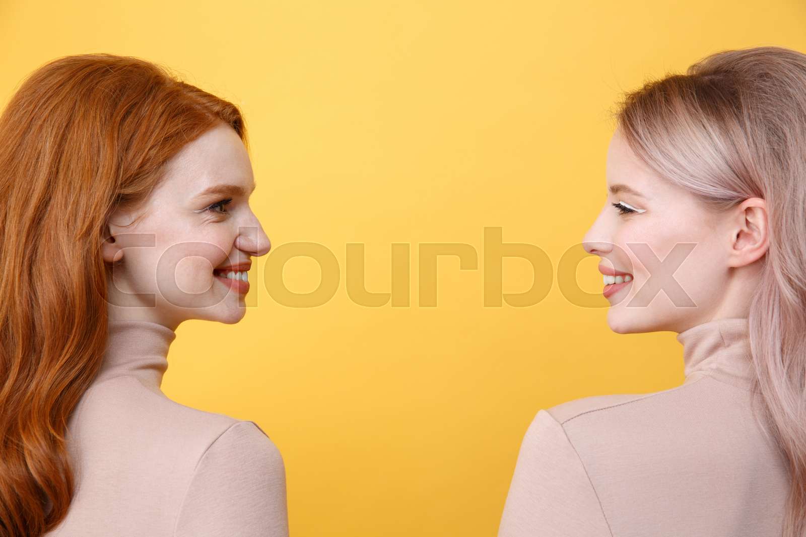 Side view photo of happy young two ladies friends | Stock image | Colourbox