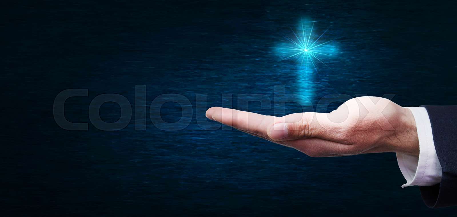 Cross in the hand. | Stock image | Colourbox