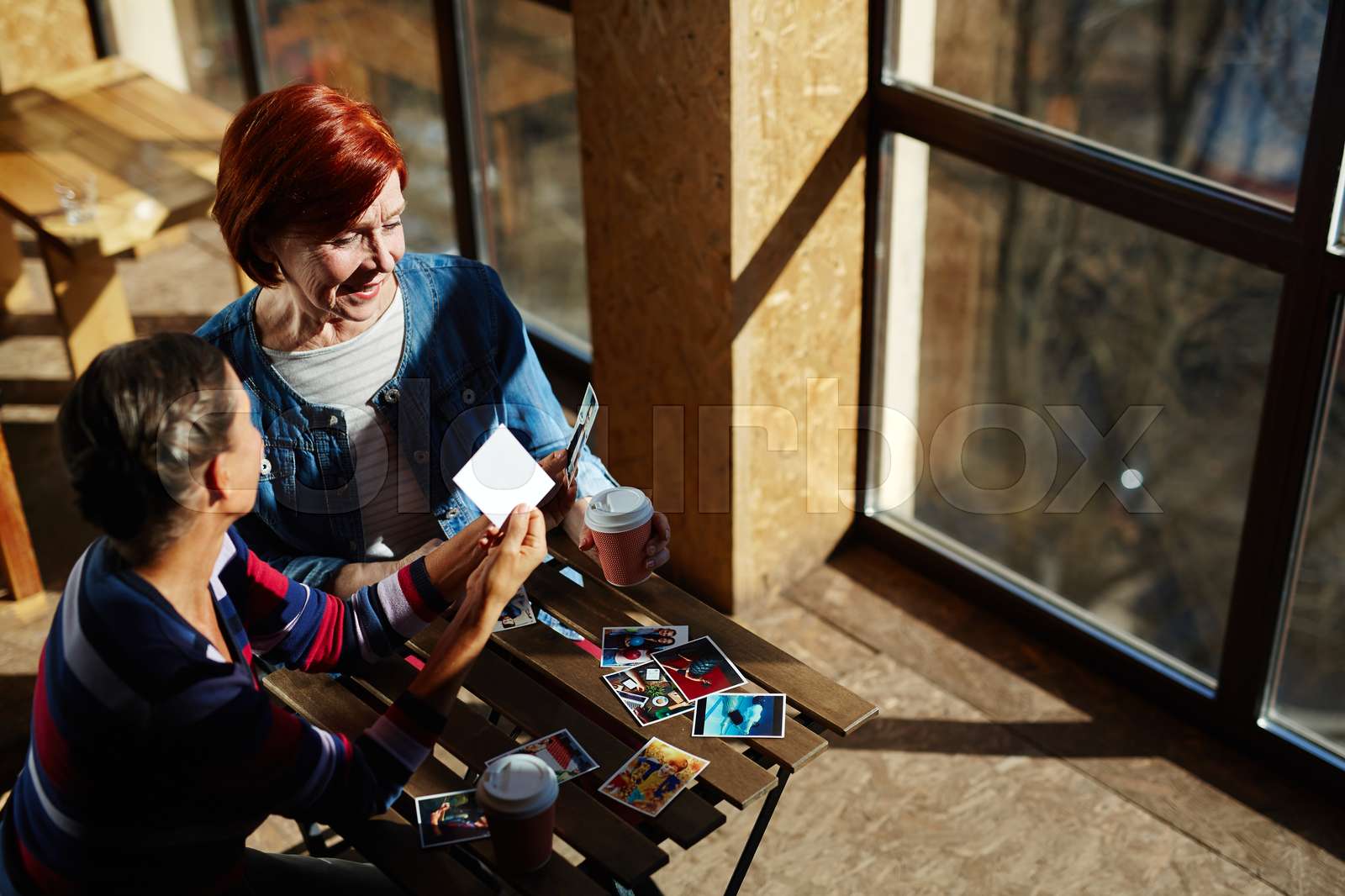 Looking through photos | Stock image | Colourbox