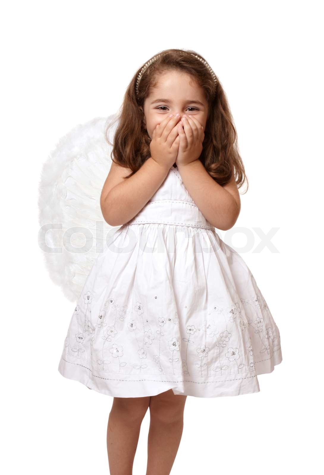 Little angel or fairy girl giggling with two hands covering her mouth ...