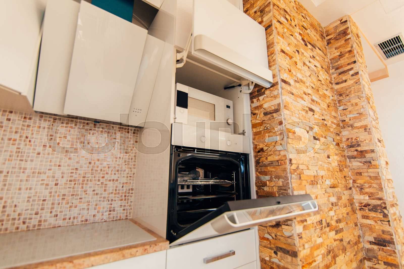 The oven in the kitchen. Stove with oven. The kitchen in the apa ...