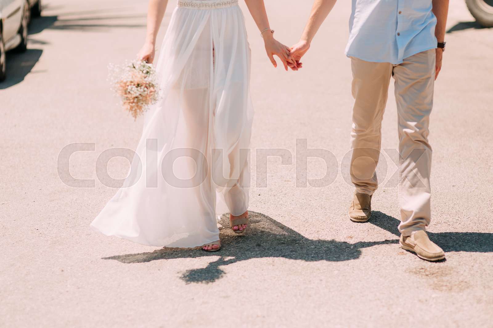 The newlyweds hold hands. Couple holding hands. Wedding in Monte ...