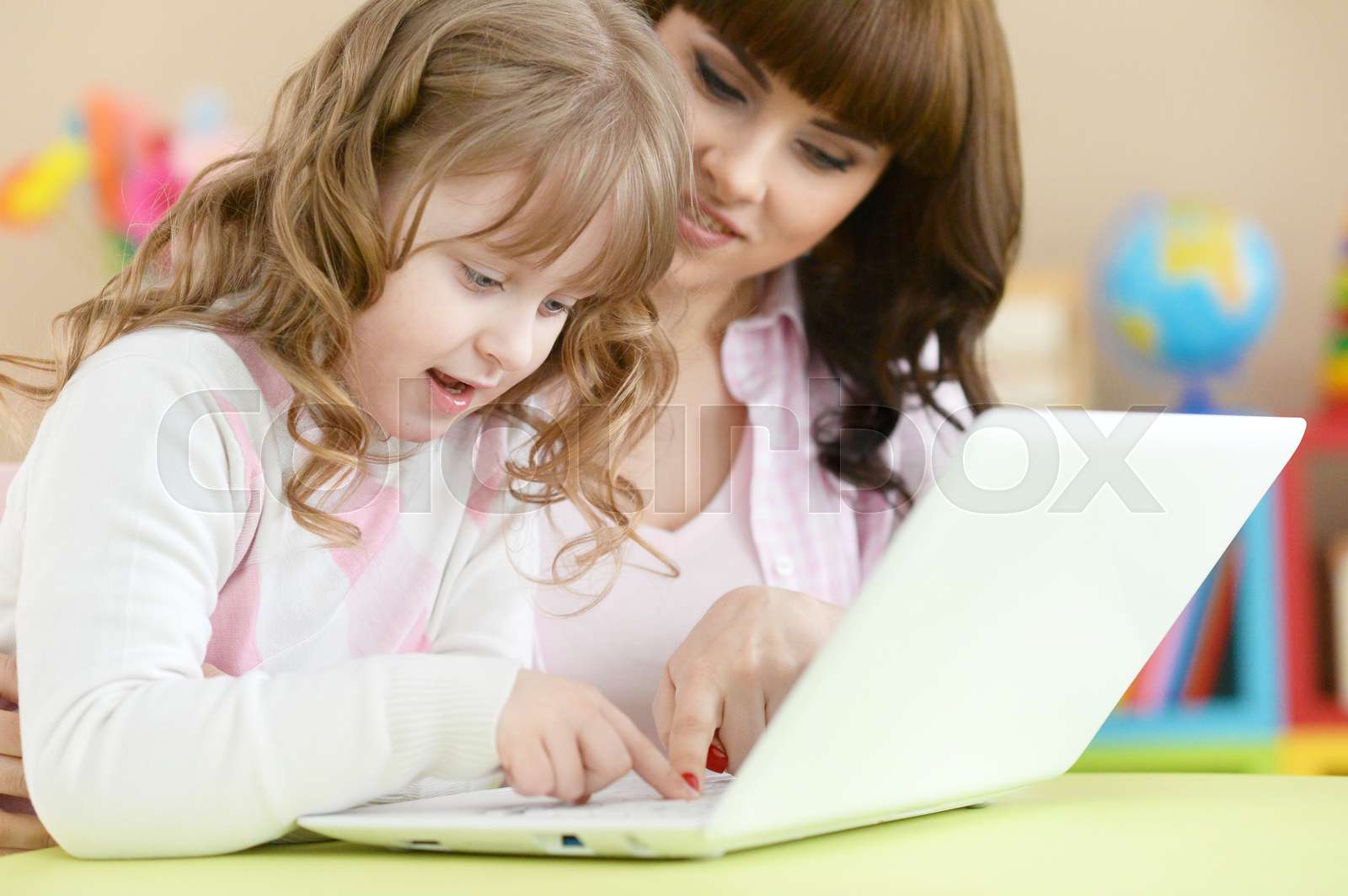 Mother and daughter doing lessons | Stock image | Colourbox