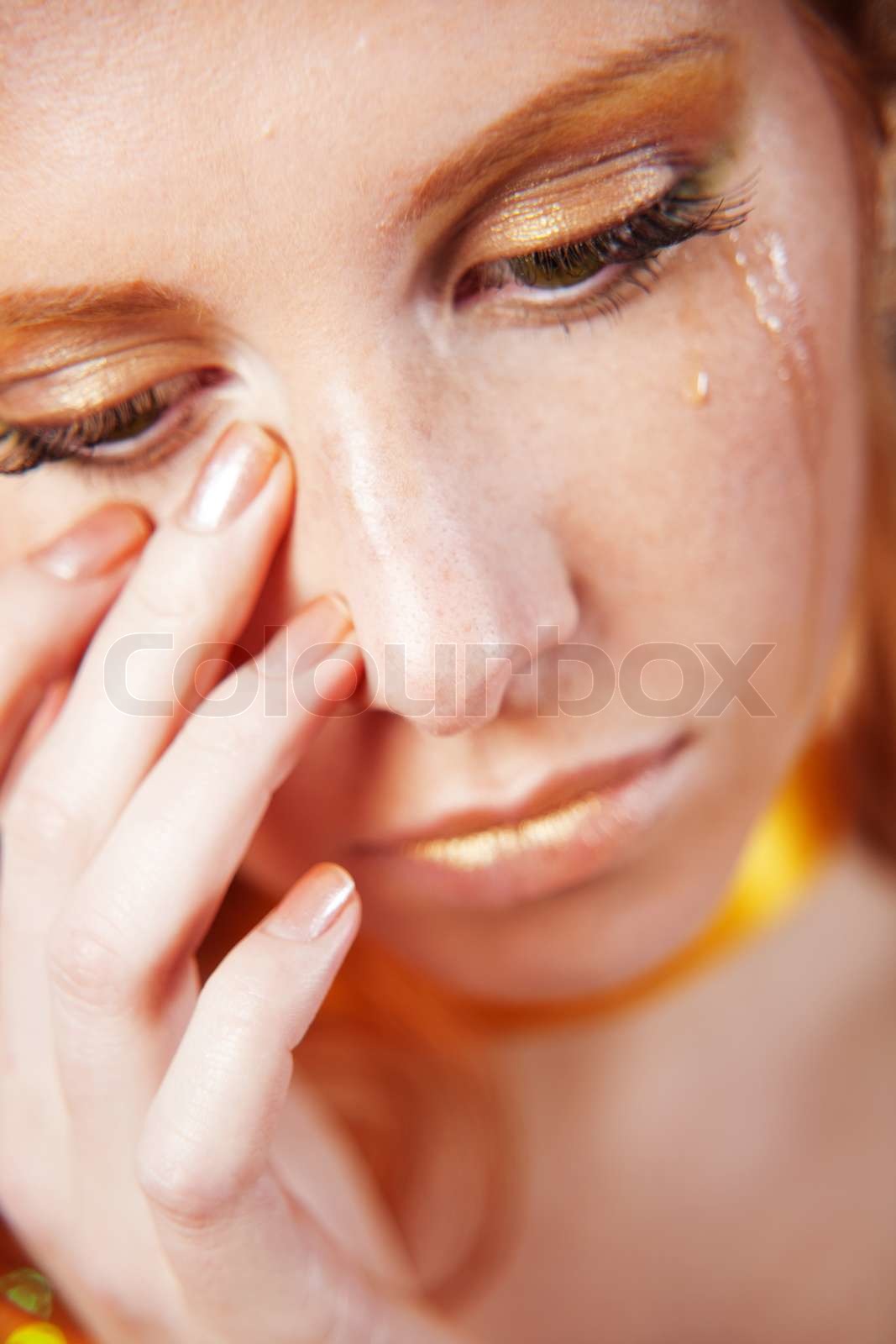 Closeup of crying woman with tears | Stock image | Colourbox