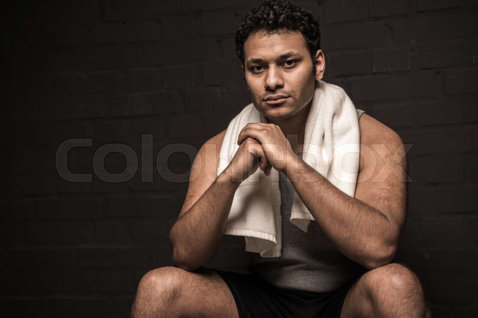 handsome man resting at gym locker room | Stock image | Colourbox