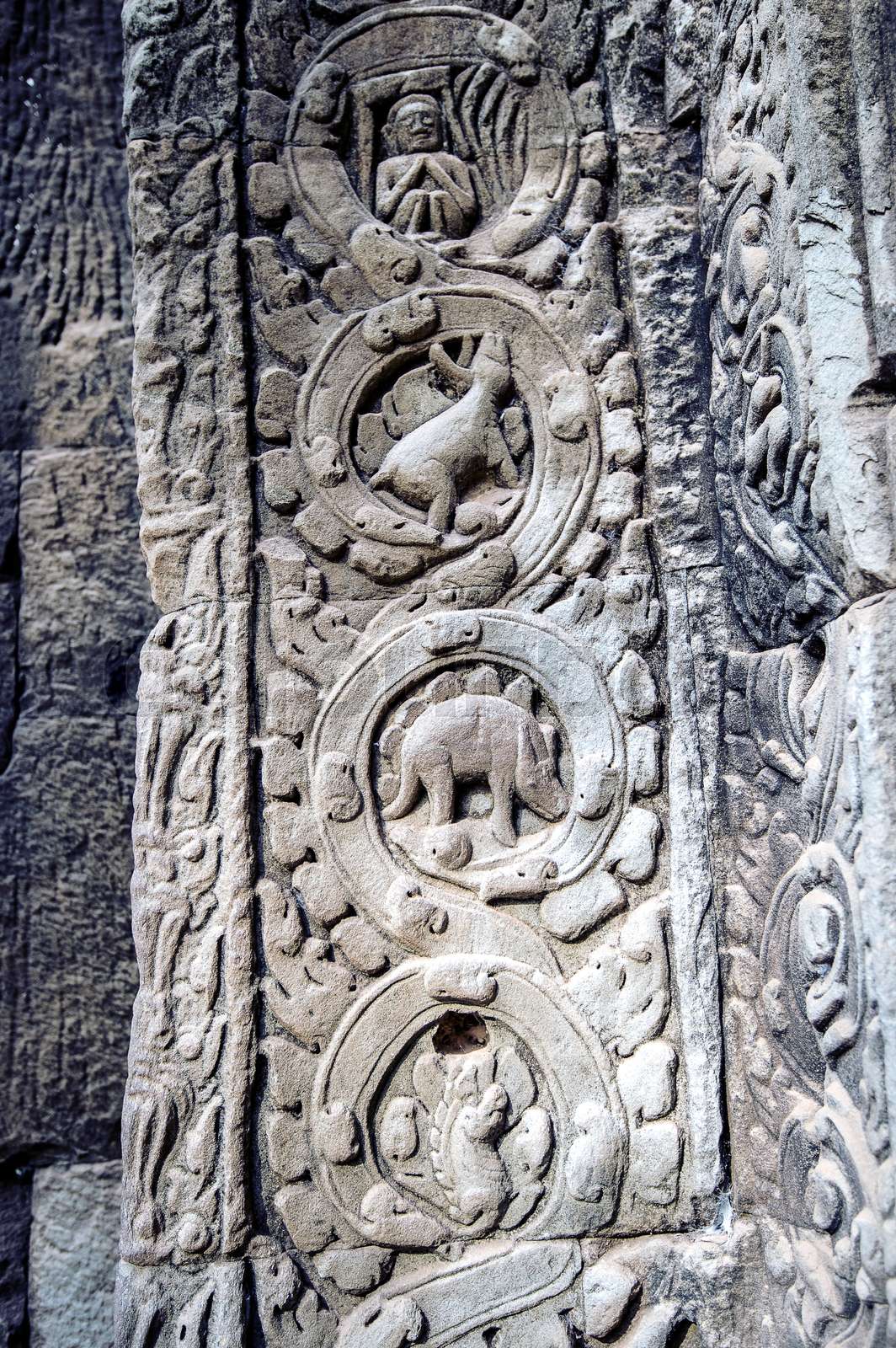 sculpted stone depicting a dinosaur at the ancient Ta Prohm temple at ...