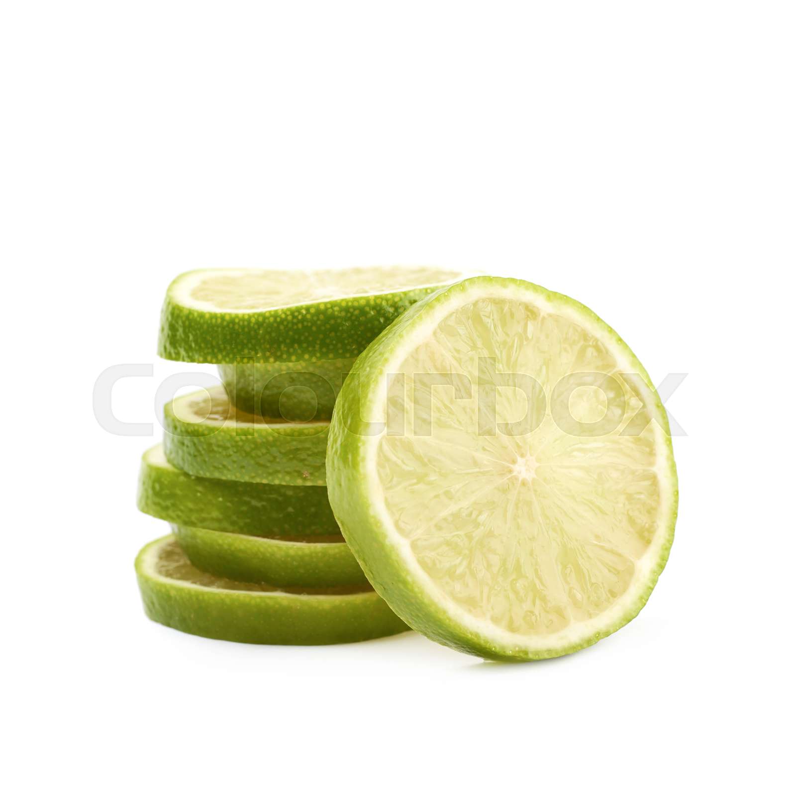 Pile of multiple lime slices isolated | Stock image | Colourbox