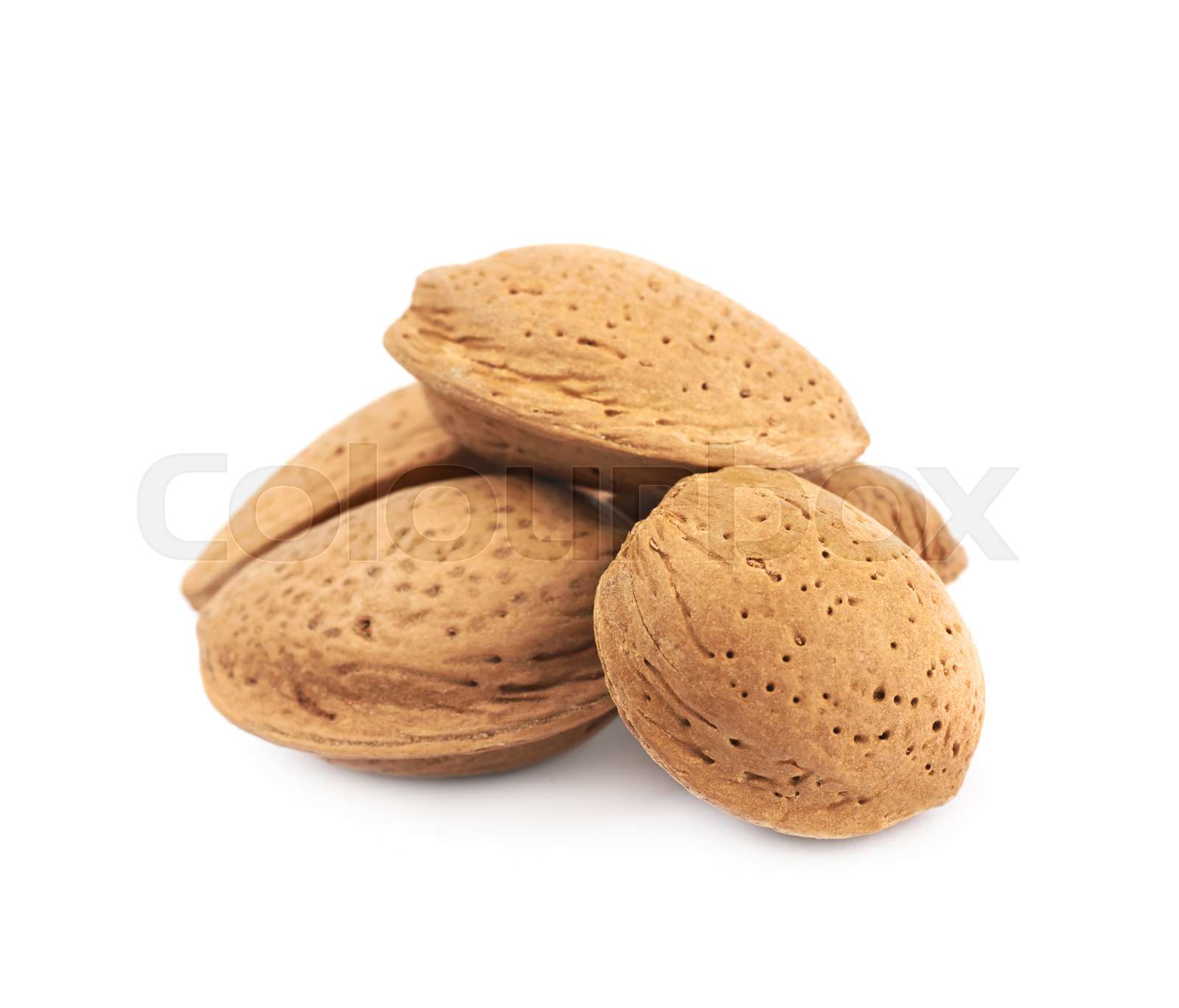 Pile of almond nuts isolated | Stock image | Colourbox