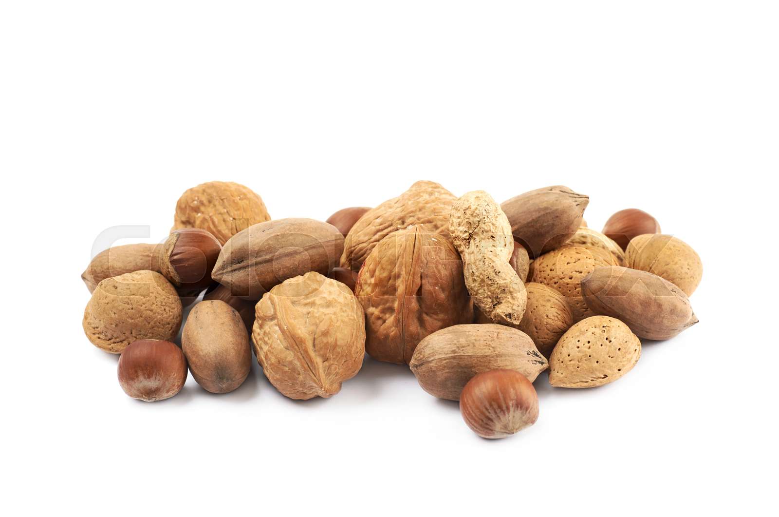 Pile of multiple kind of nuts isolated | Stock image | Colourbox