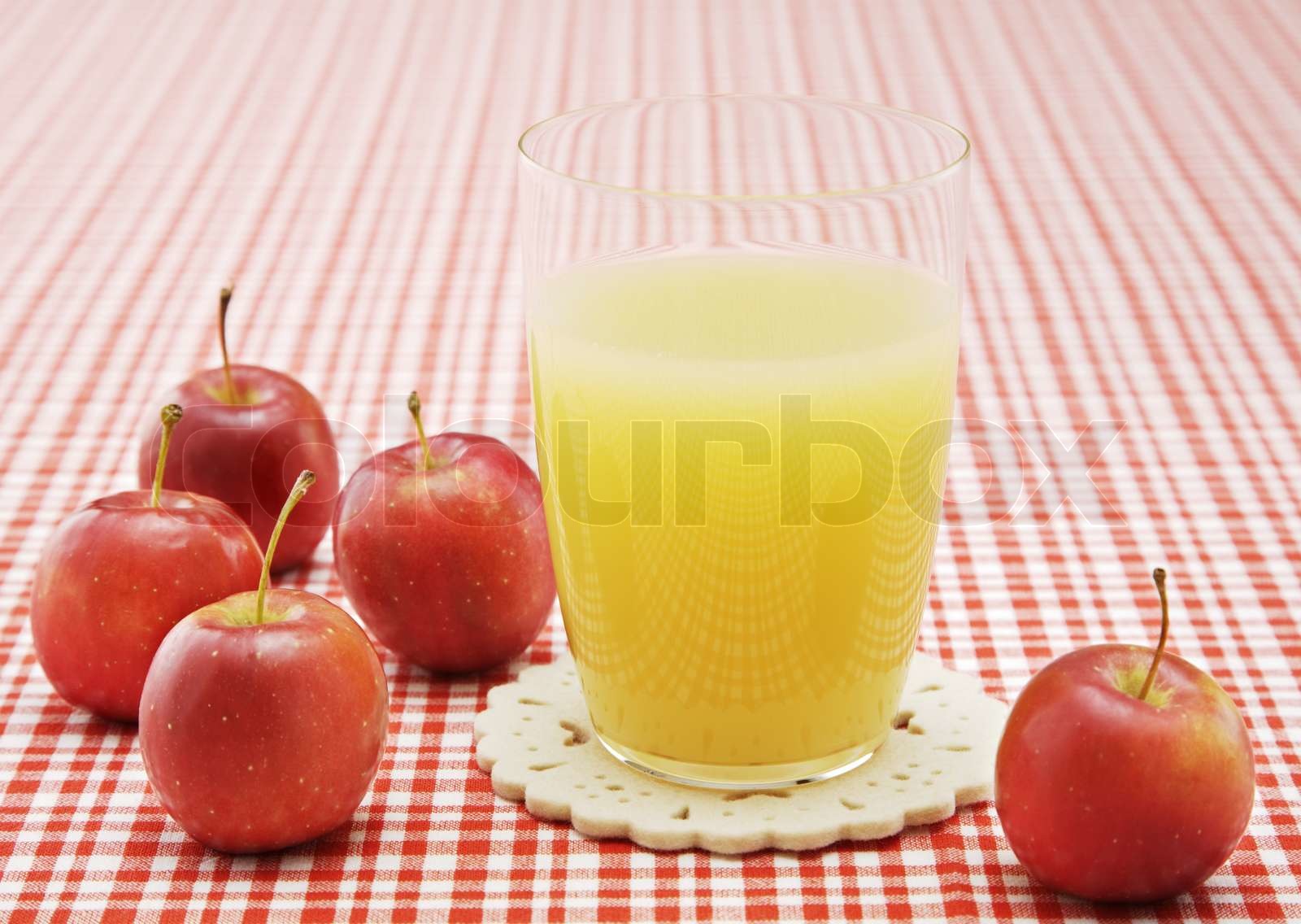 red apple with juice isolated on white | Stock image | Colourbox