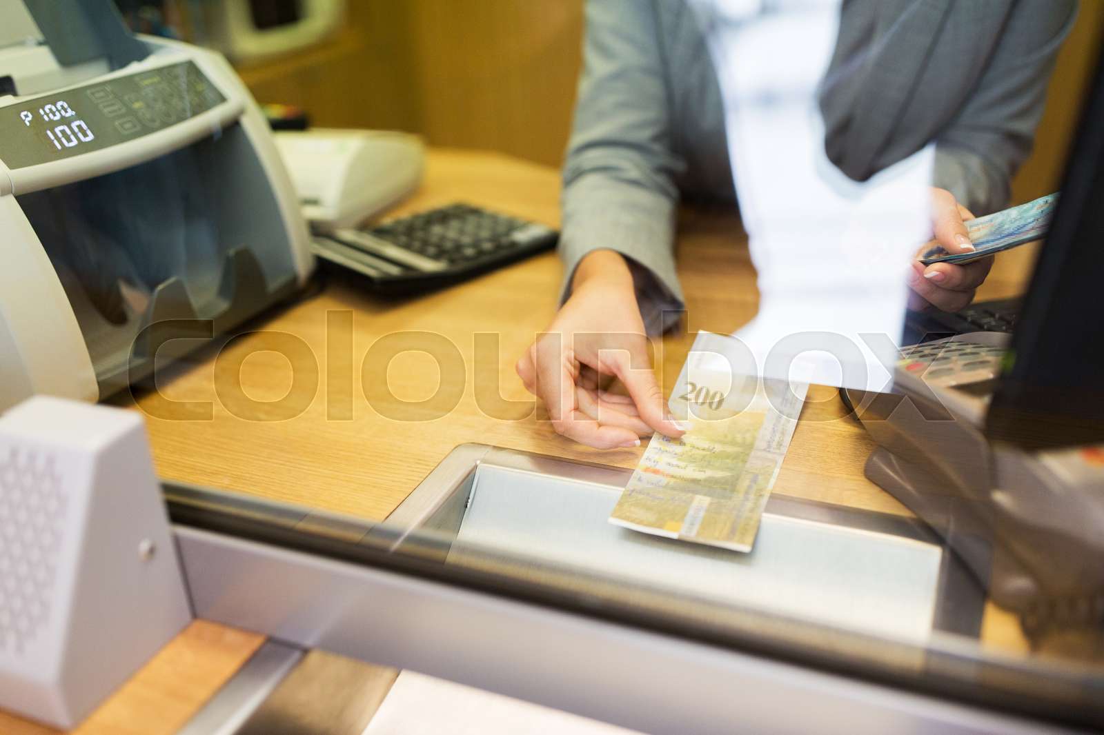 clerk counting cash money at bank office | Stock image | Colourbox