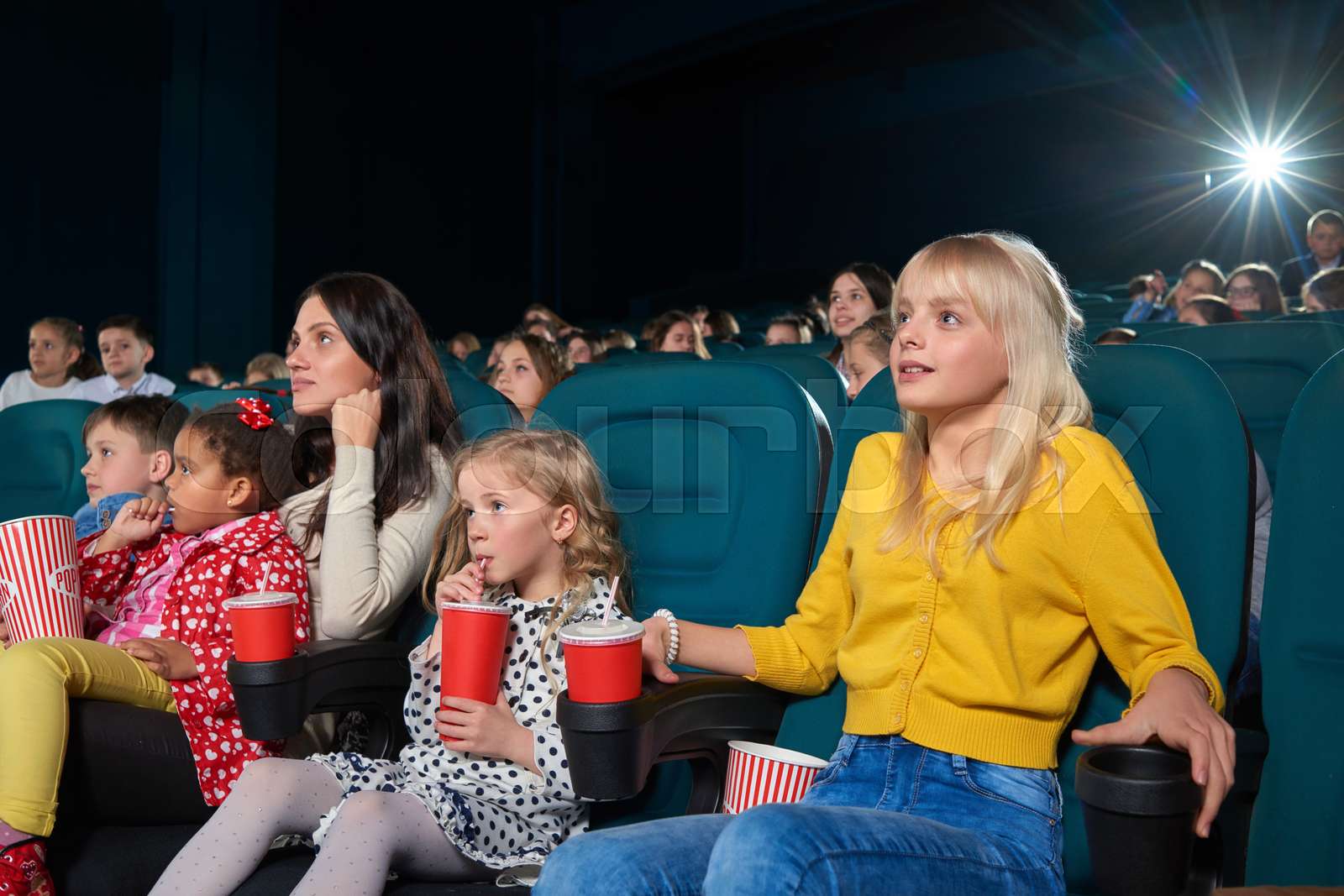 Children watching movies at the cinema | Stock image | Colourbox