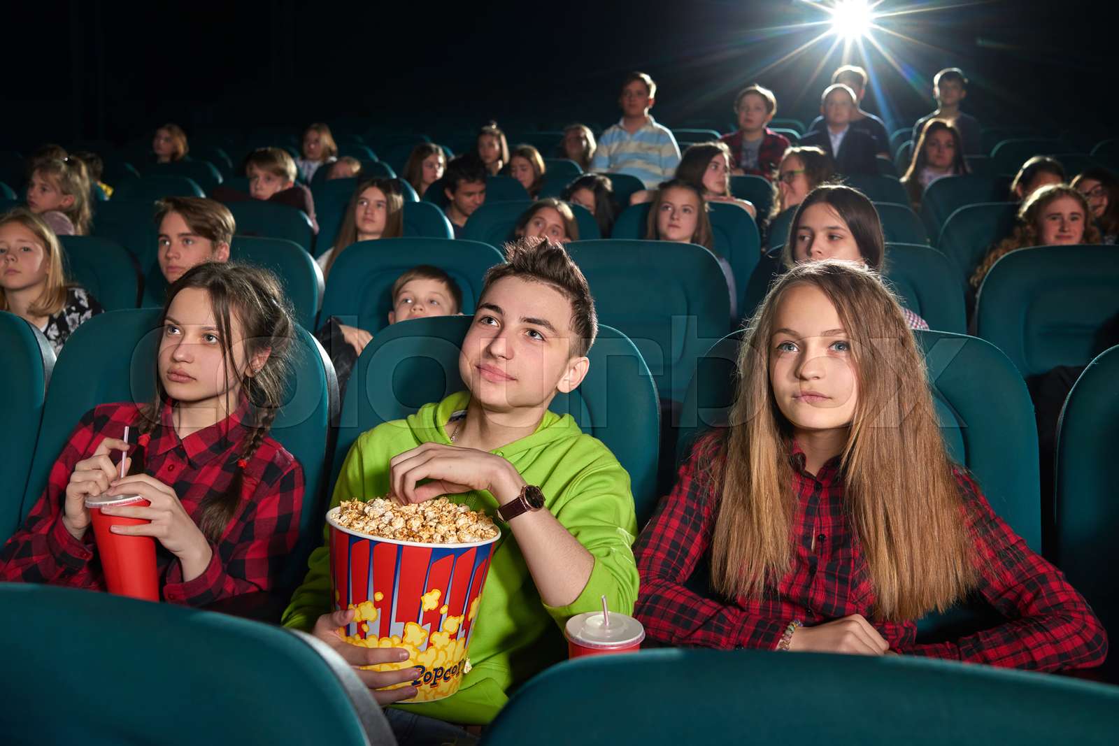 Children watching movies at the cinema | Stock image | Colourbox