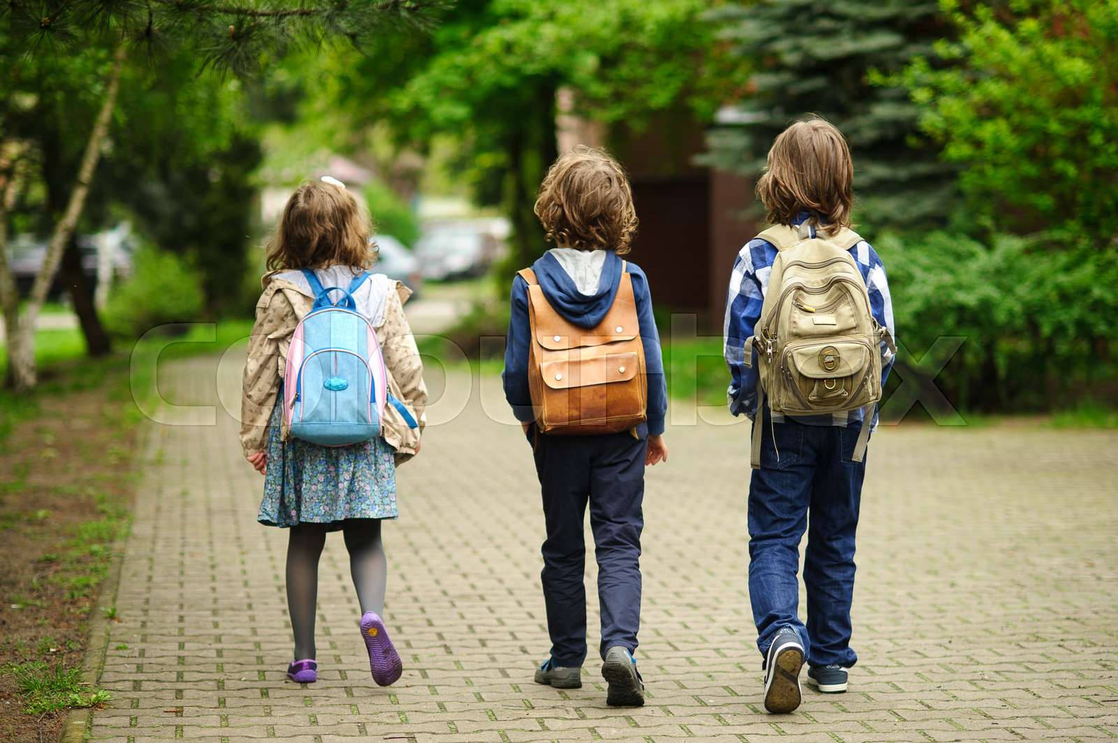 Little school students hurry on occupations. | Stock image | Colourbox