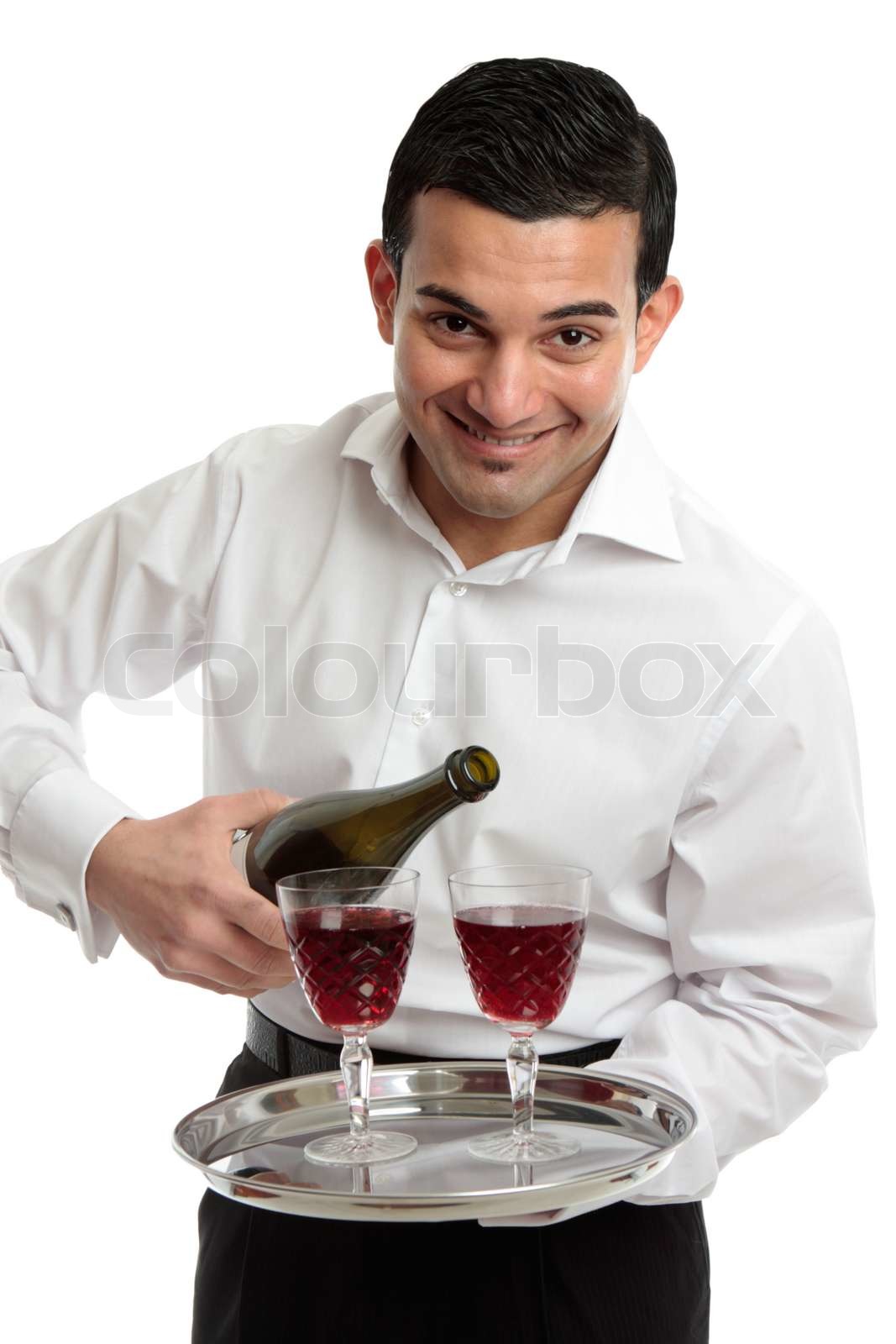 A friendly hospitality smile as a waiter or servant pours wine | Stock ...