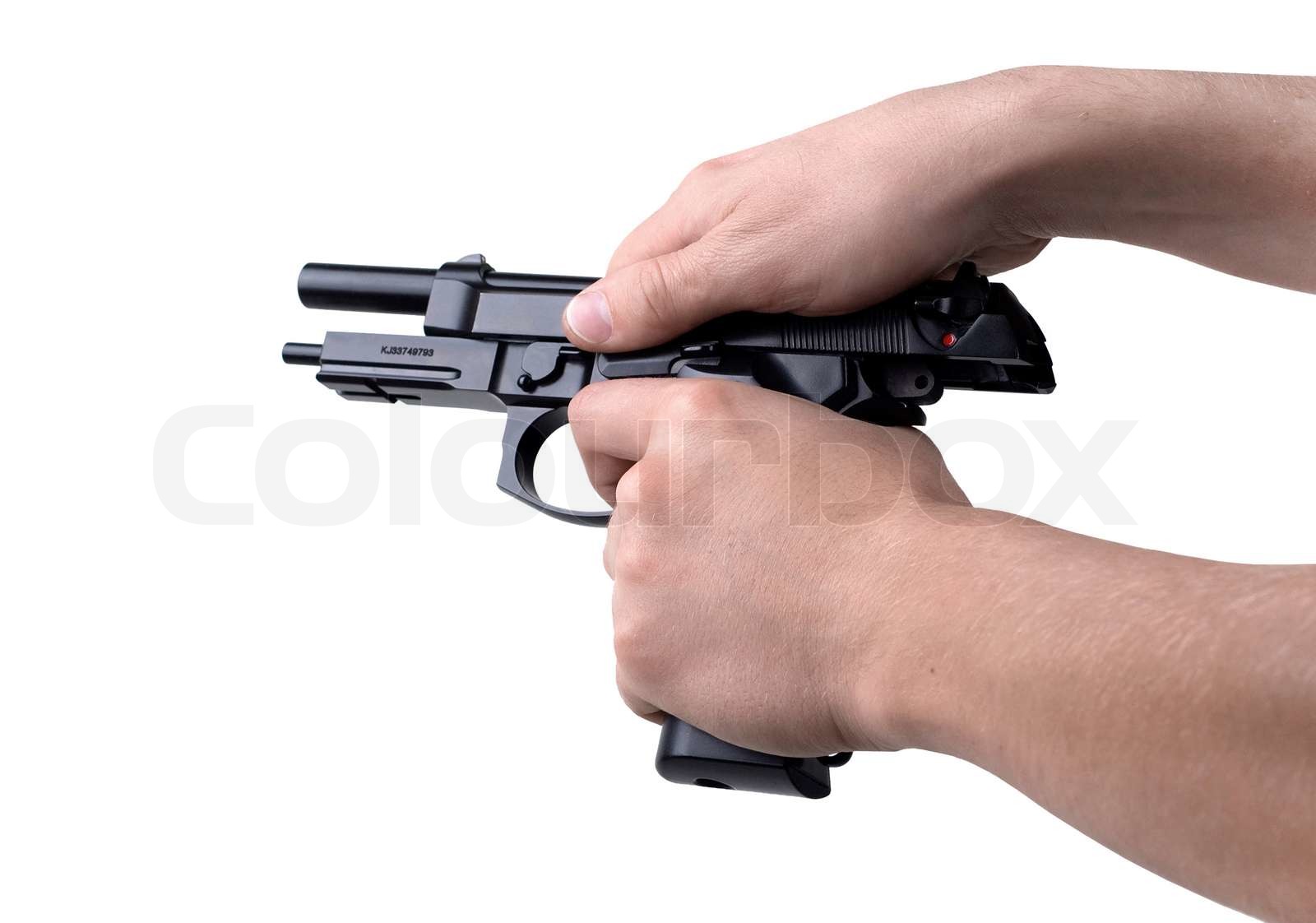 Waffe in der Hand auf einem weißen Hintergrund | Stock Bild | Colourbox