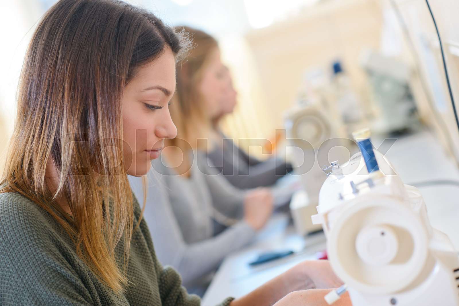 Women using sewing machines | Stock image | Colourbox
