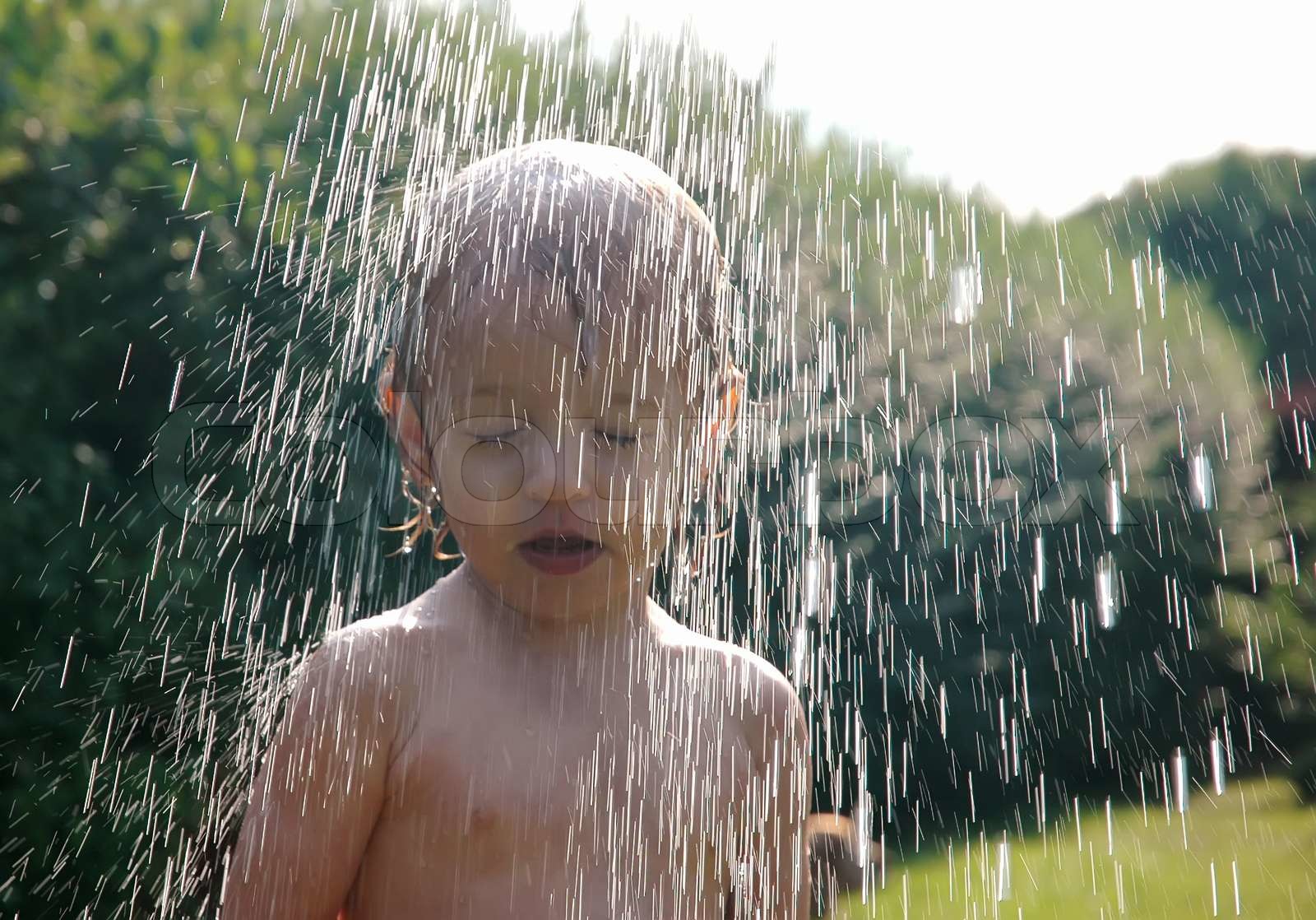 Little girl and a cold shower | Stock image | Colourbox