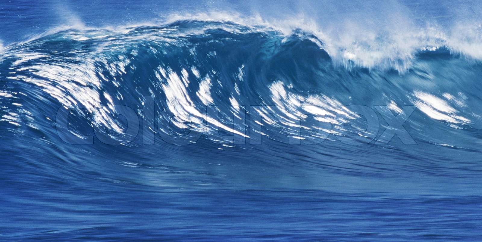 Big Blue Surfing Wave Breaks in Ocean | Stock image | Colourbox