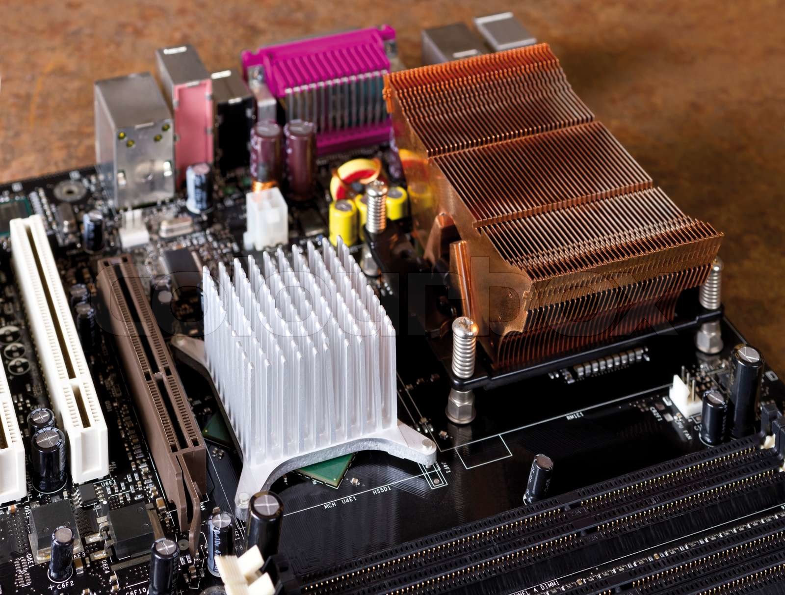 detail of a motherboard in front of rusty back | Stock image | Colourbox