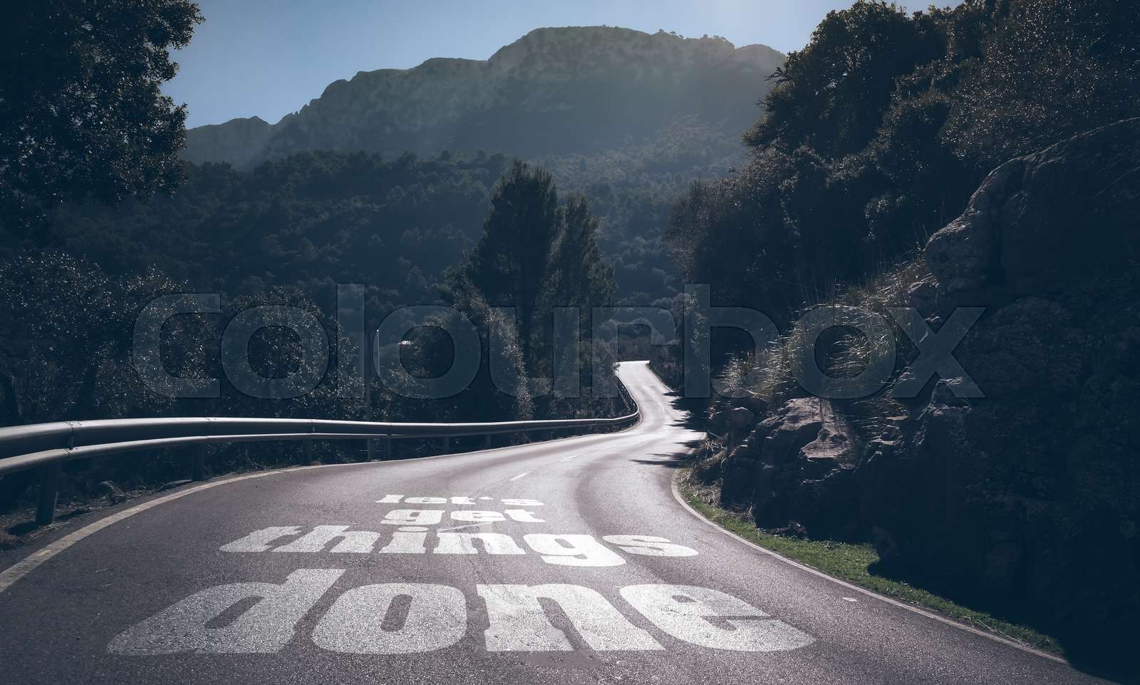 long deserted road through mountains with words lets get things done ...