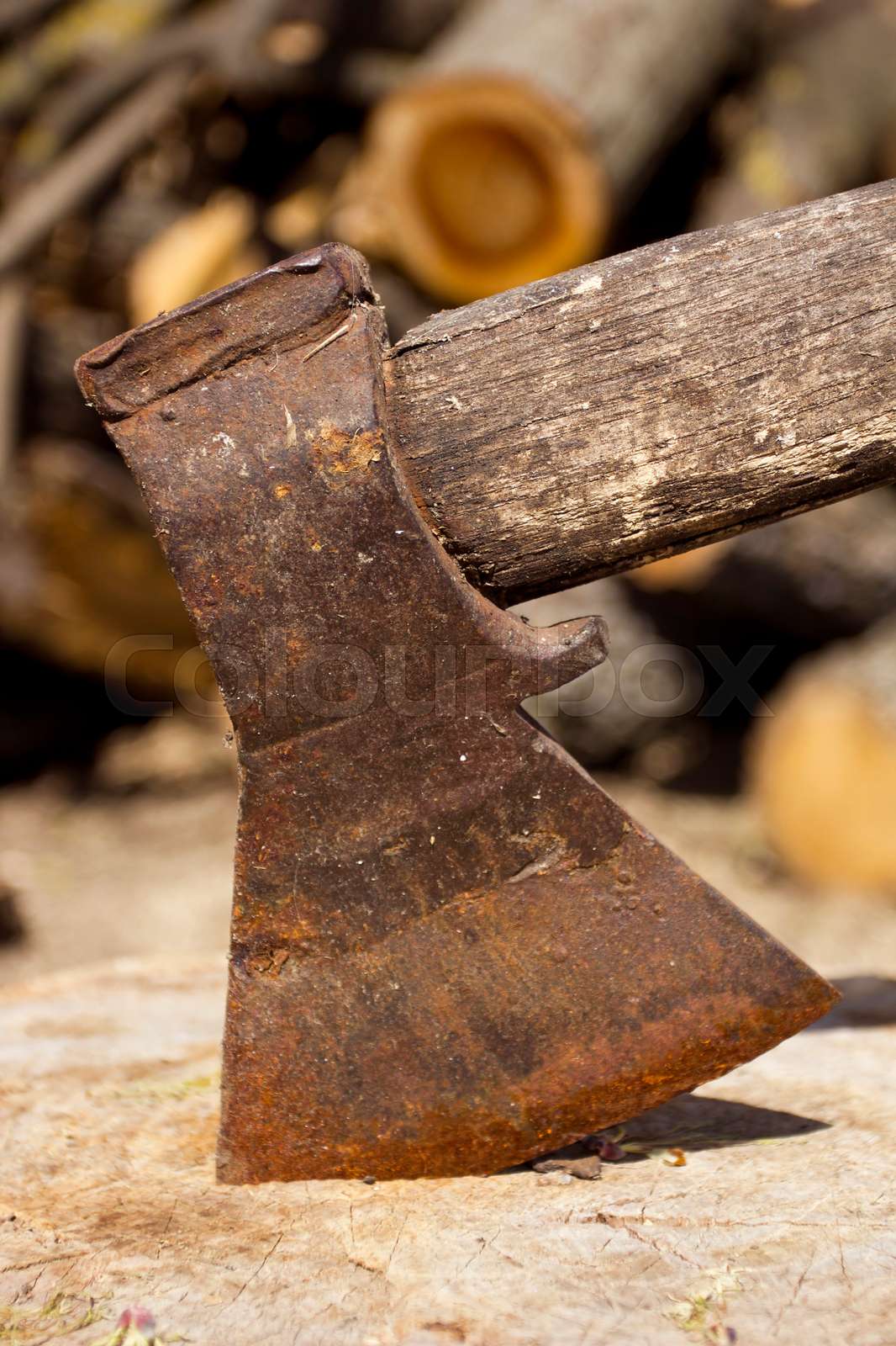 Axe in a stump | Stock image | Colourbox