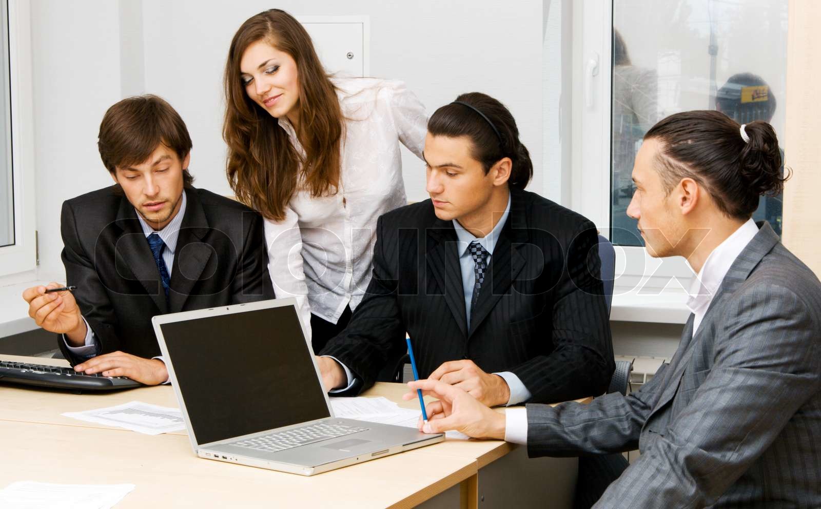 Photo of office workers having a discussion | Stock image | Colourbox
