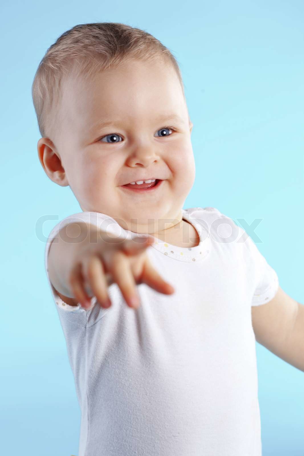 Baby showing something by finger | Stock image | Colourbox