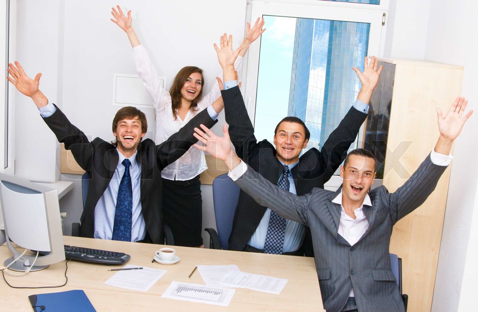 Joyful business team in office celebrating in office | Stock image ...
