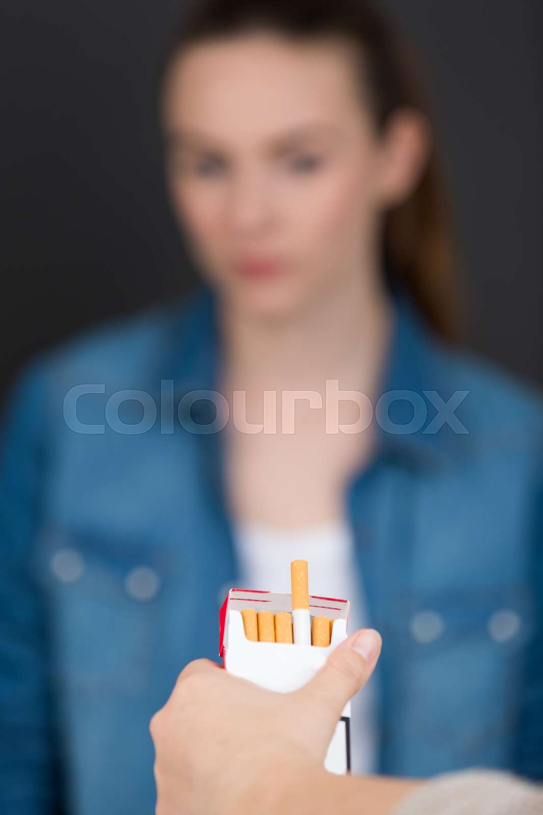 offering a cigarette | Stock image | Colourbox