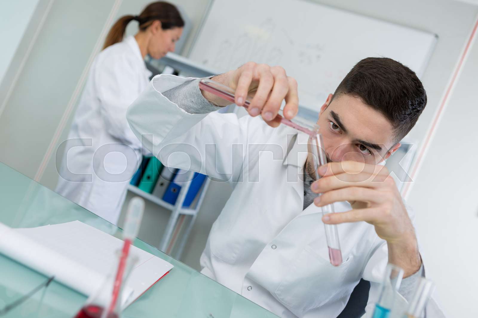 Young man in science lab | Stock image | Colourbox