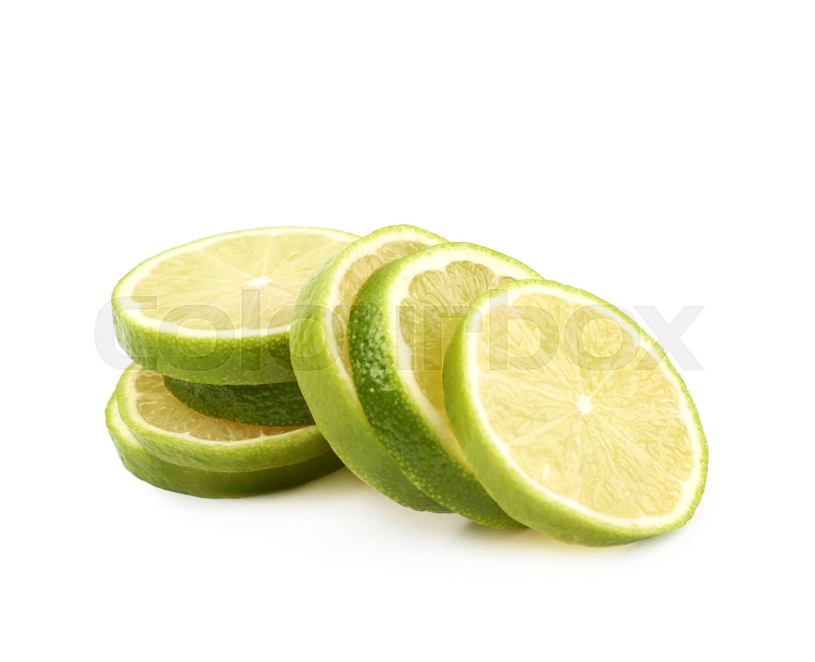 Pile of multiple lime slices isolated | Stock image | Colourbox