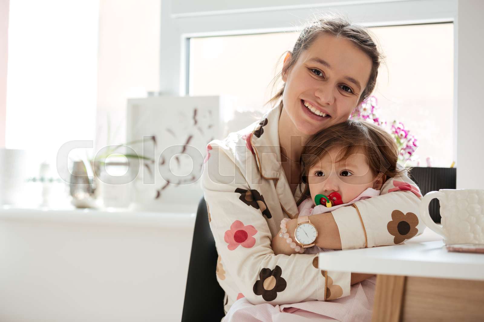 Mother hugging her child | Stock image | Colourbox