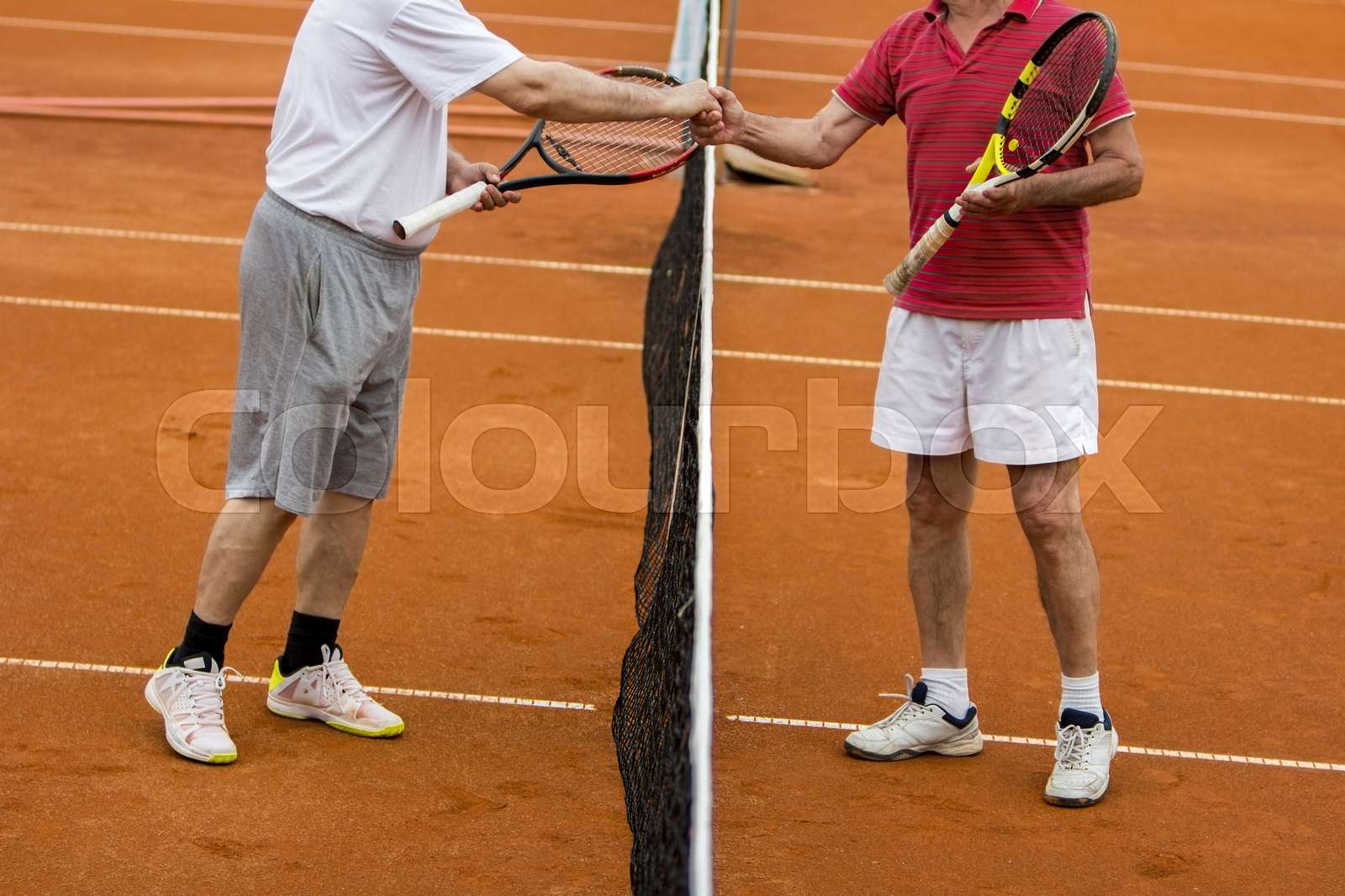 Tennis players shake hands after the tennis match | Stock image | Colourbox