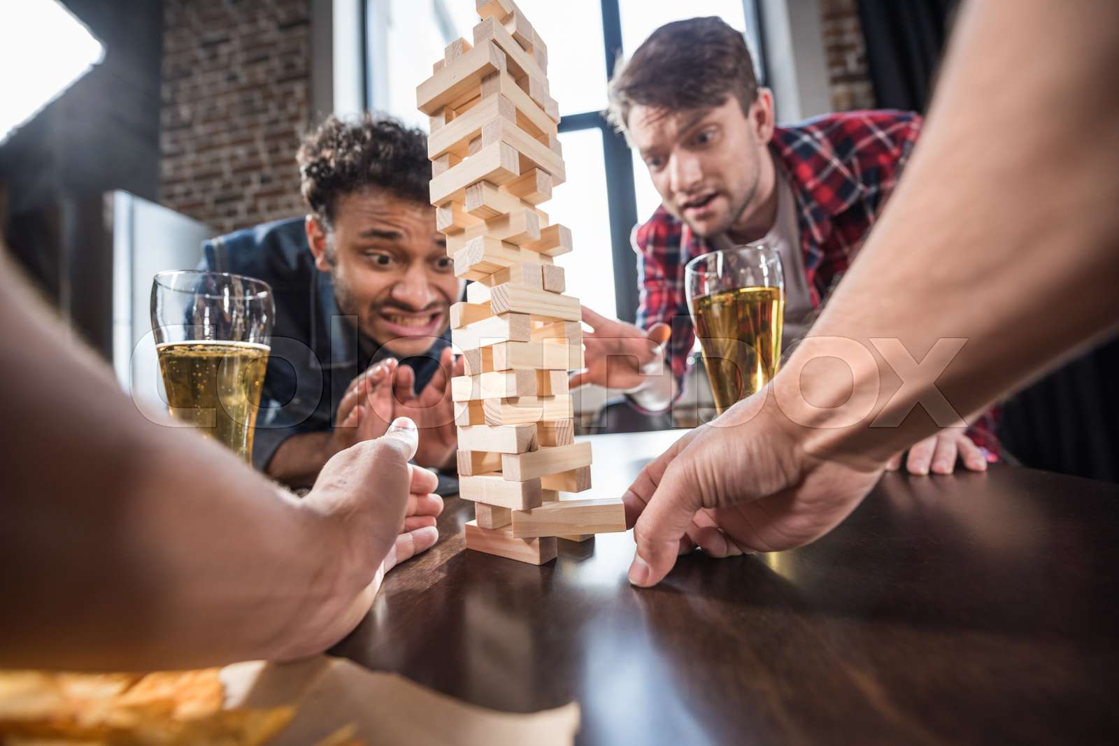 men playing jenga game | Stock image | Colourbox