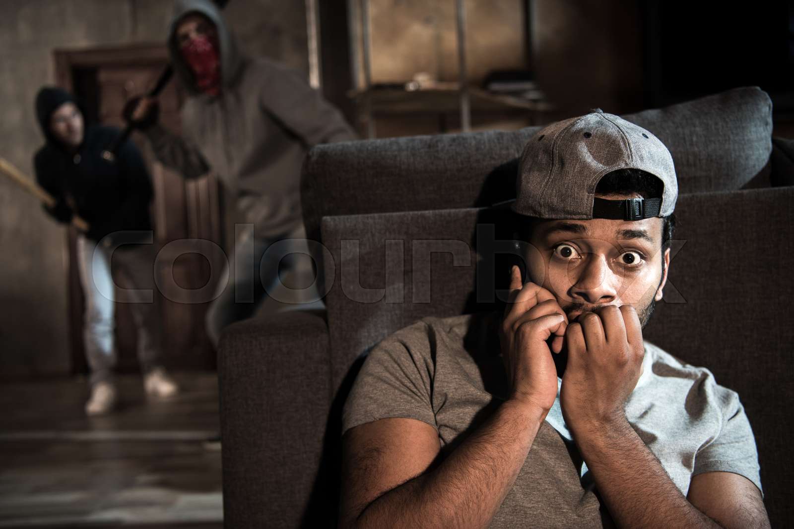 Burglars and scared man | Stock image | Colourbox